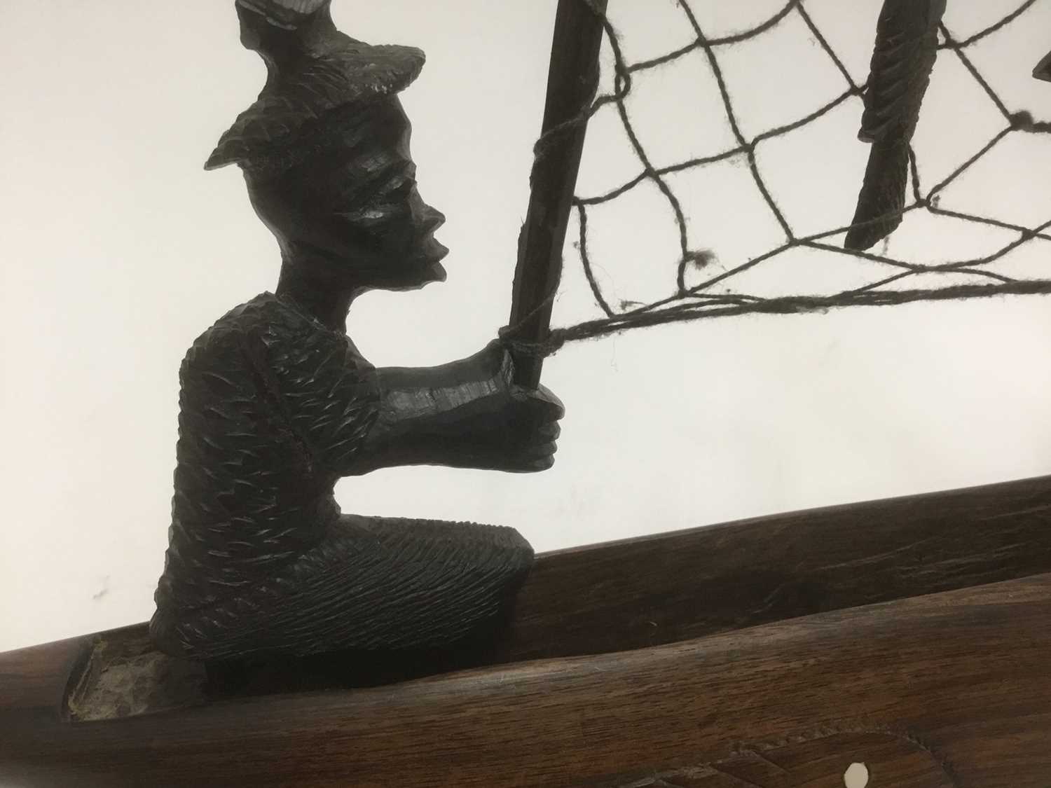 Lot 1845 - African carved wooden model of a fishing
