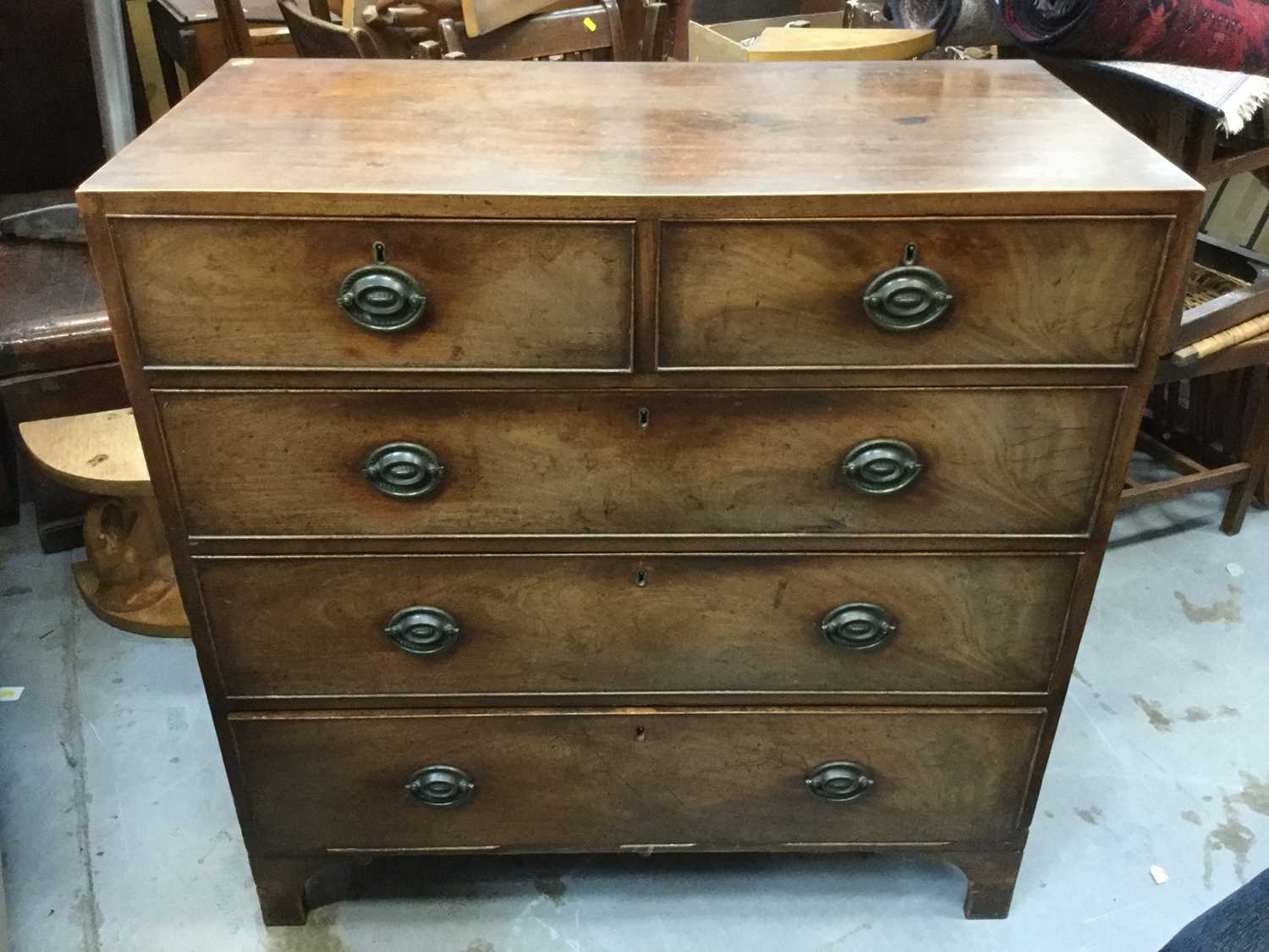 Lot 897 - Georgian mahogany chest of two short and