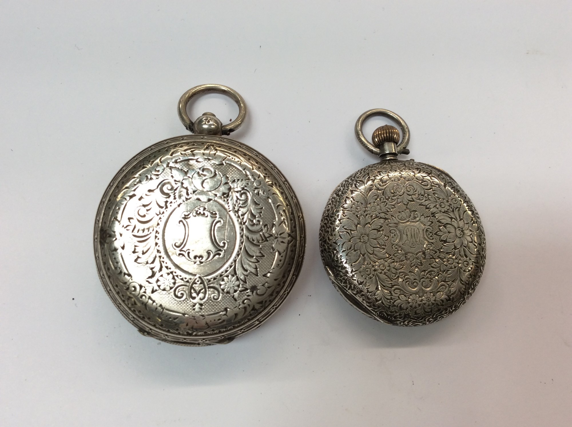 Lot 671 - Two silver cased fob watches, spherical