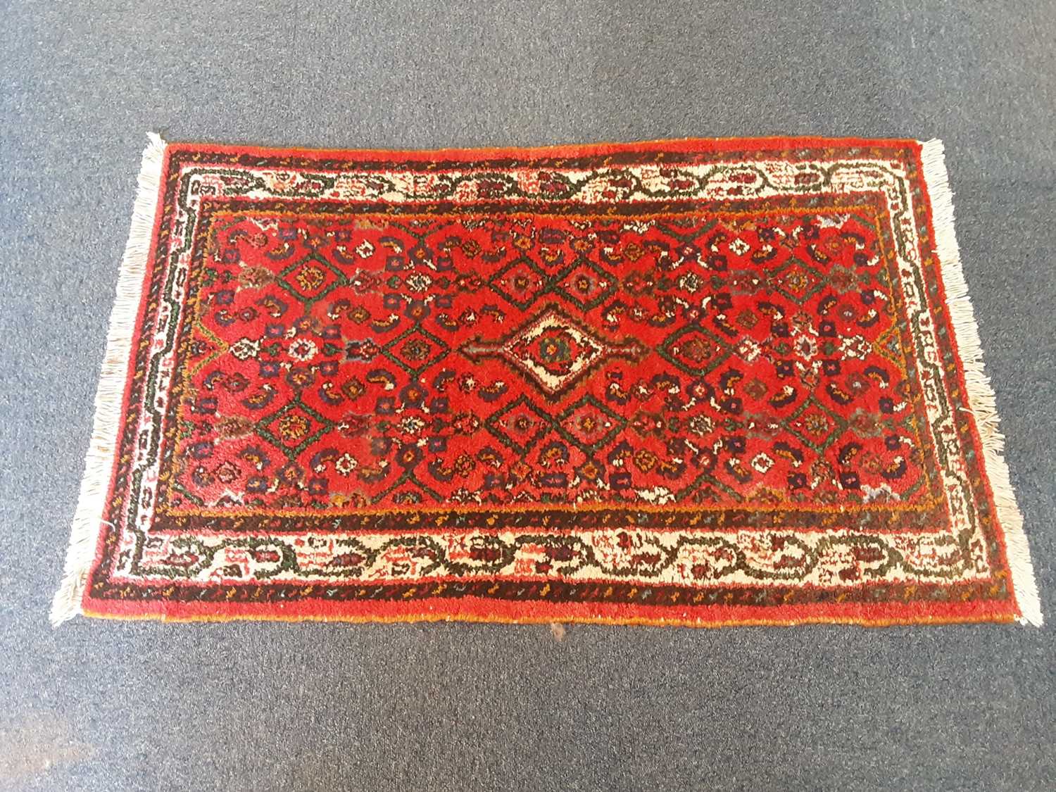 Lot 1066 - Eastern rug with geometric decoration on