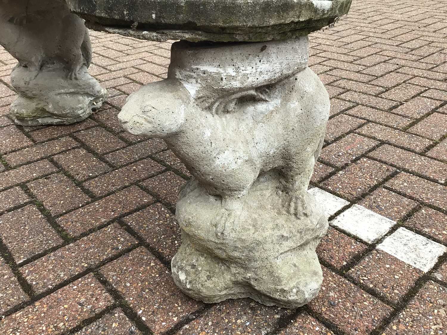 Lot 52 - Concrete garden bench with otter supports