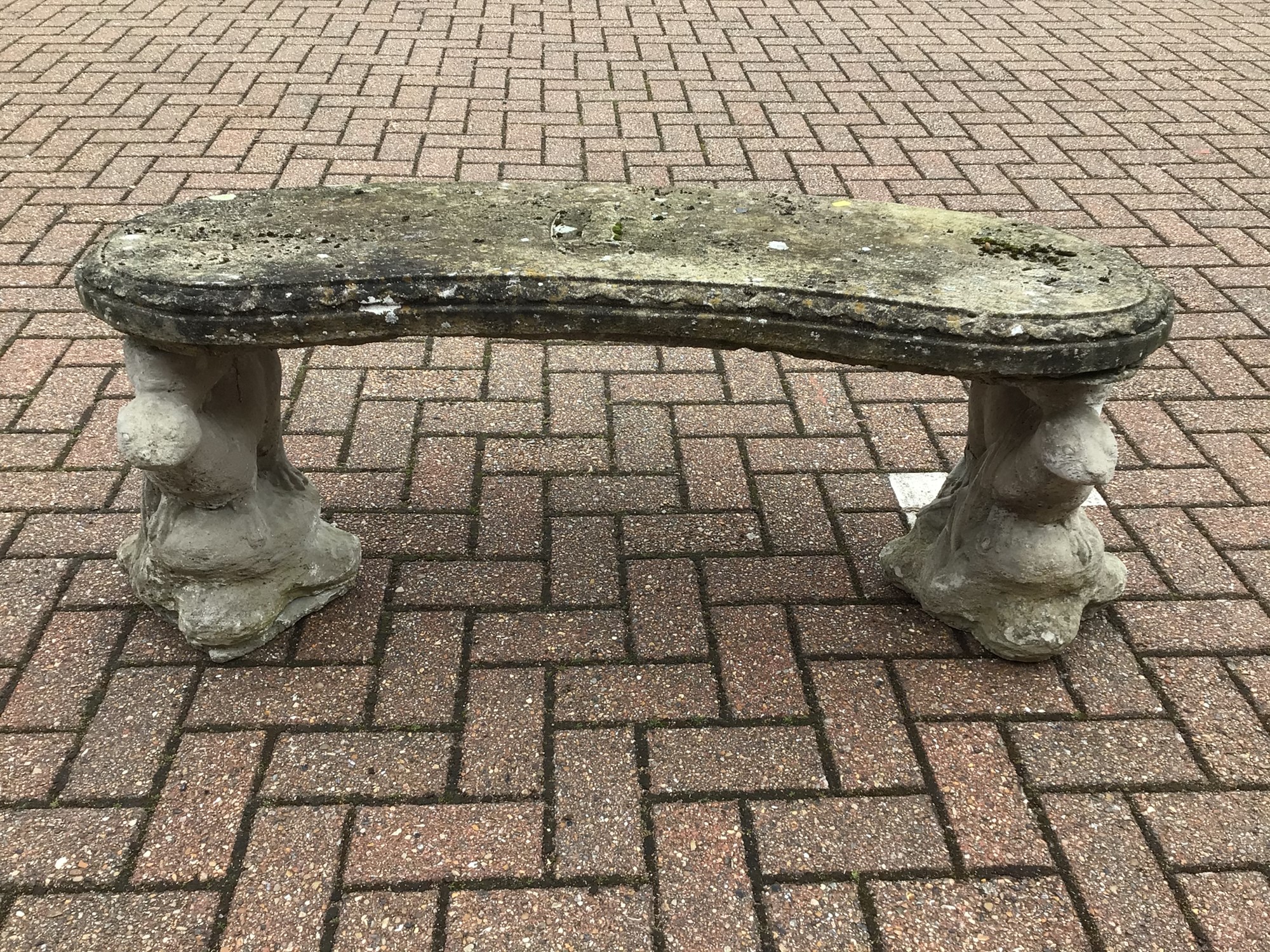 Lot 52 - Concrete garden bench with otter supports