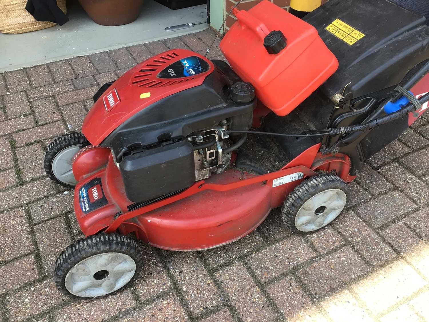 Lot 57 - Toro TX - 159 petrol lawn mower with grass