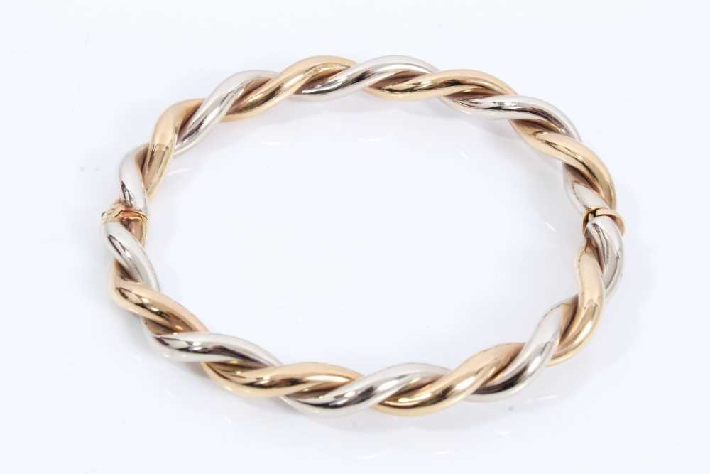 Lot 228 - 9ct two colour gold twisted bangle