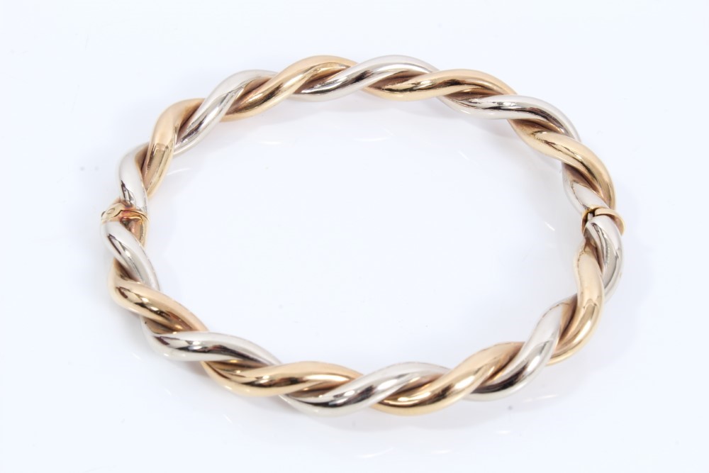 Lot 228 - 9ct two colour gold twisted bangle
