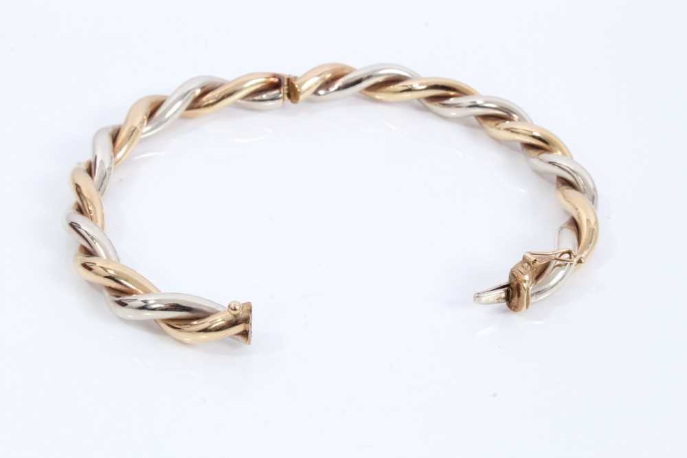 Lot 228 - 9ct two colour gold twisted bangle