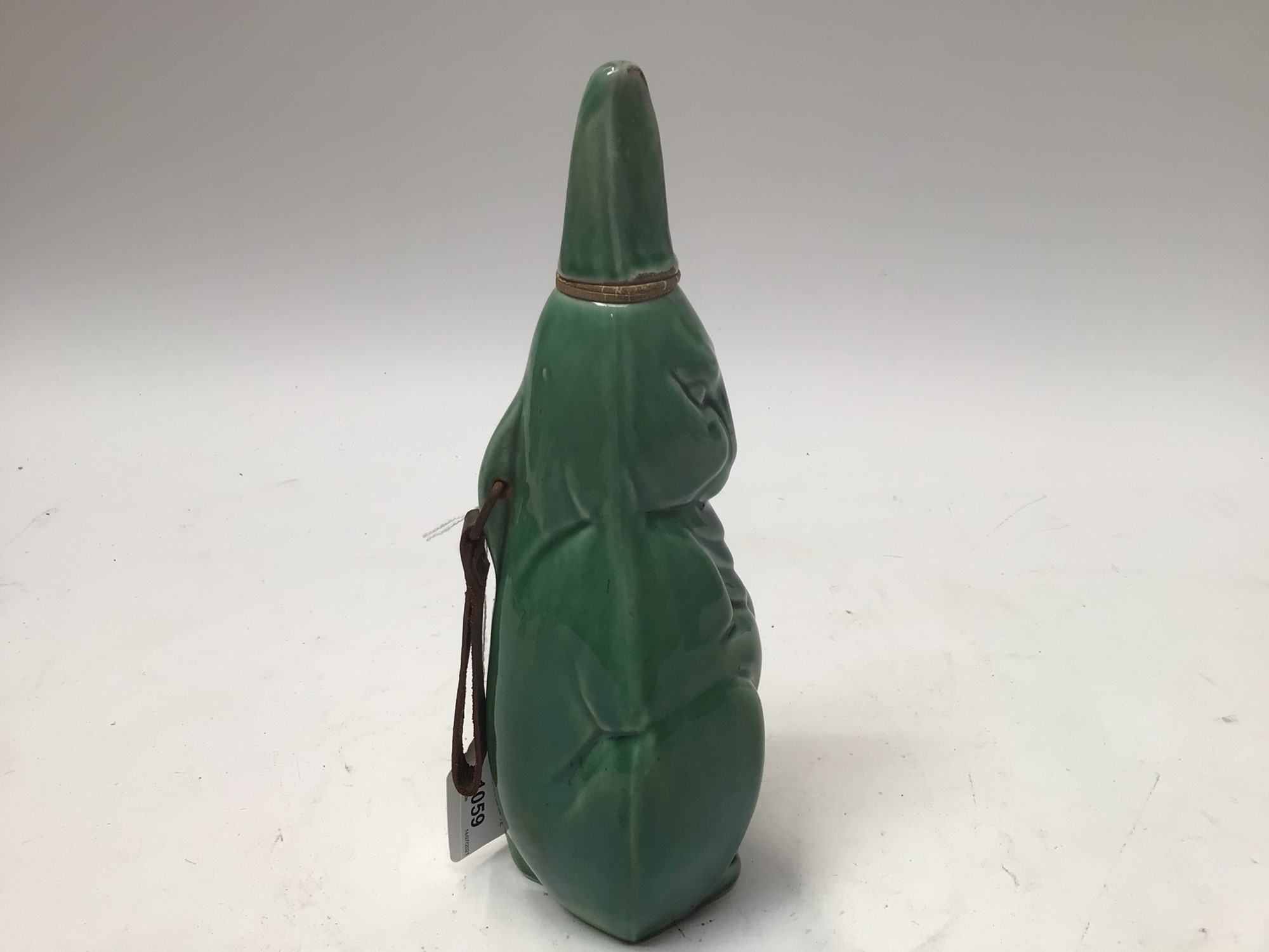 Lot 1059 - Rare 1930s Denby green glazed rabbit