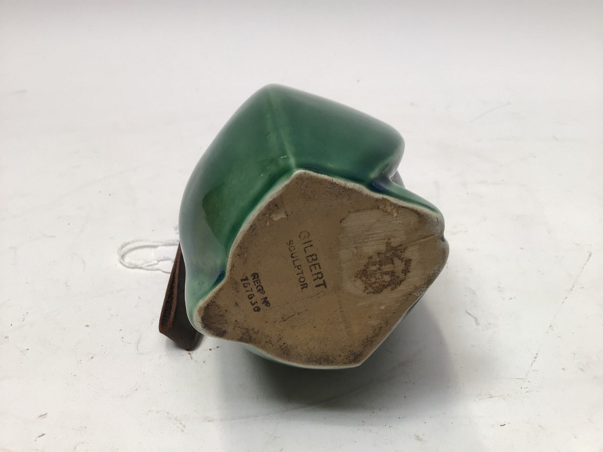 Lot 1059 - Rare 1930s Denby green glazed rabbit