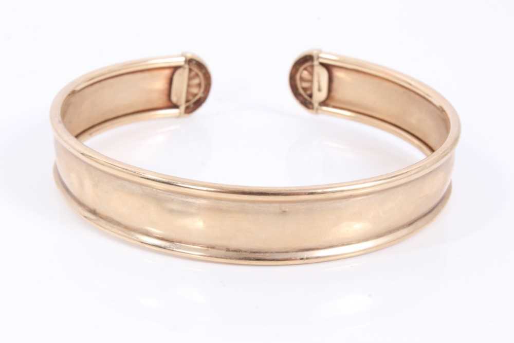 Lot 247 - Two 9ct gold torque bangles
