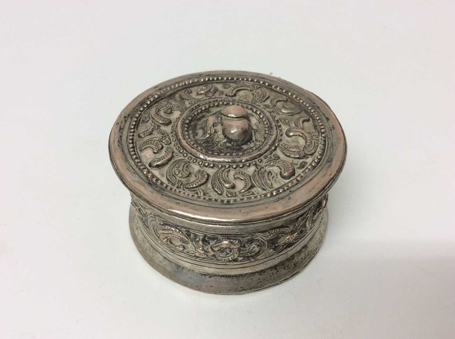 Lot 658 - Indian white metal pot and cover decorated