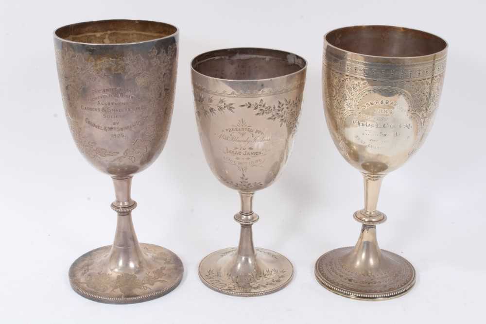Lot 338 - Three silver trophy cups of conventional