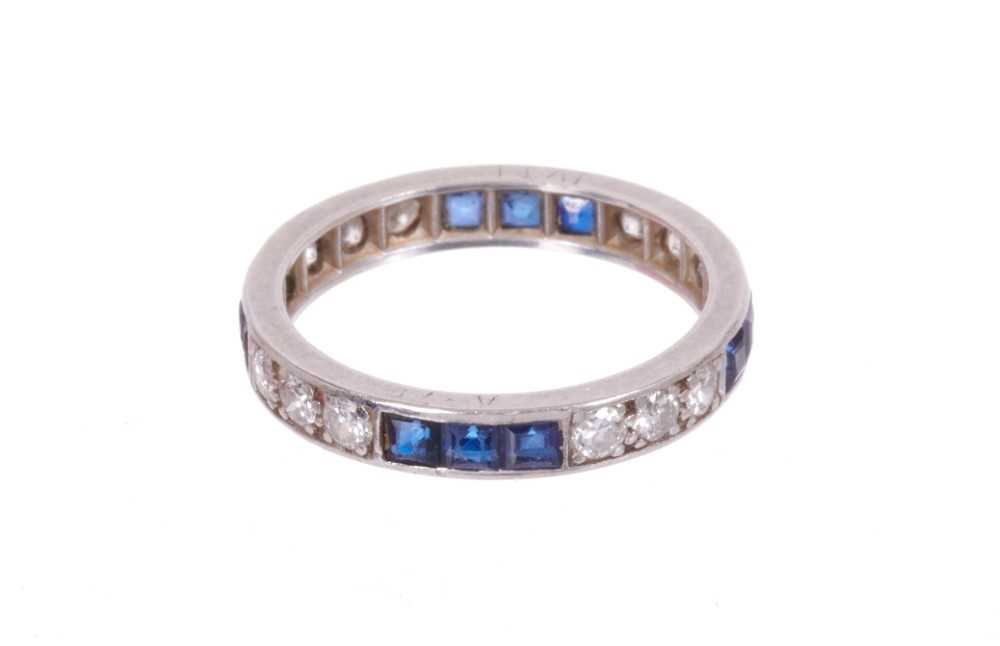 Lot 514 - Diamond and sapphire full band eternity ring