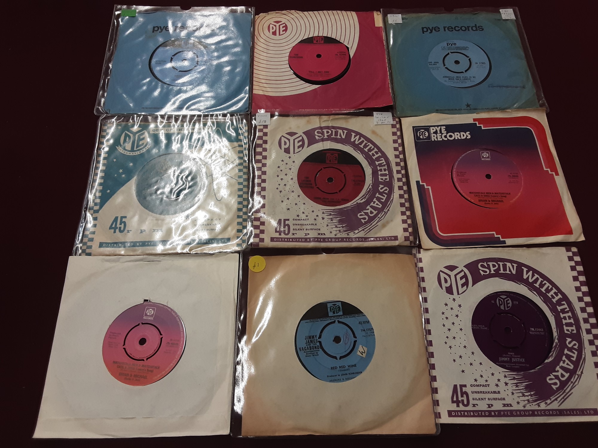 Lot 2227 - Box and carrying case of single records on